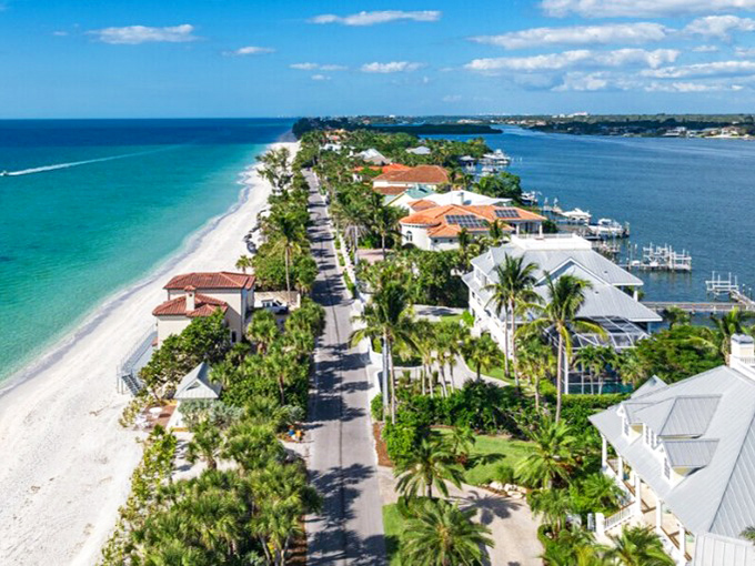 Casey Key Road winds beneath a canopy of ancient oaks draped with Spanish moss &ndash; a scenic drive that feels worlds away from Florida's tourist highways.