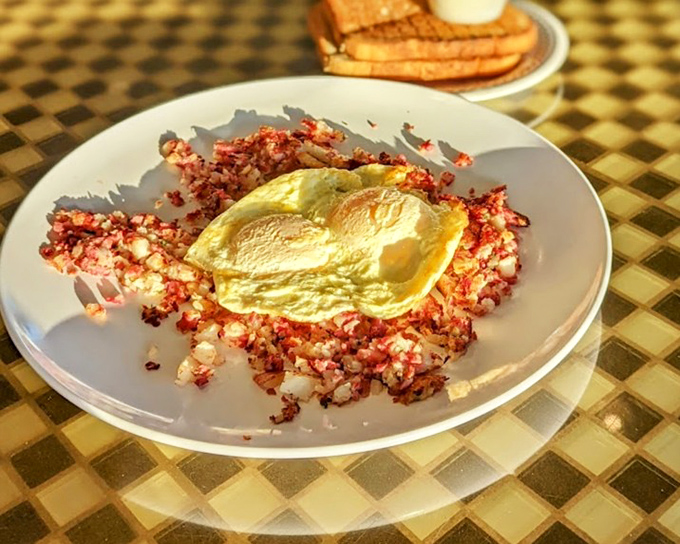 Corned beef hash crowned with a sunny-side-up egg – a breakfast worthy of champions or anyone needing serious fuel for the day.