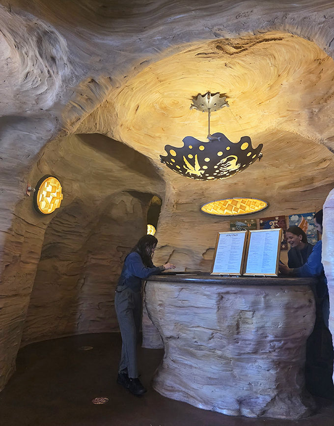 Even the host stand continues the stone illusion &ndash; check in for your reservation at what appears to be an ancient Greek artifact.