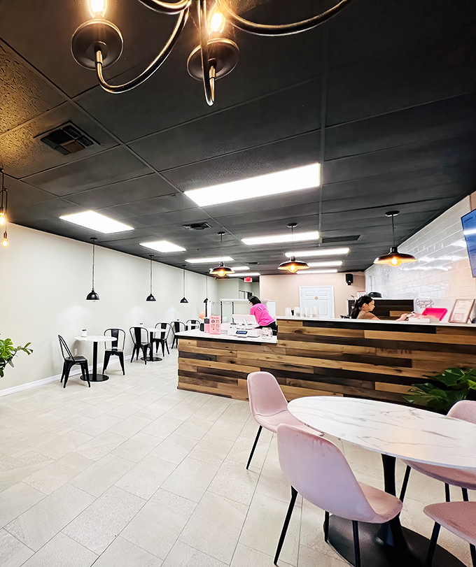 The wooden counter serves as command central, where tea artists and pancake wizards transform simple ingredients into Instagram-worthy creations with practiced precision.
