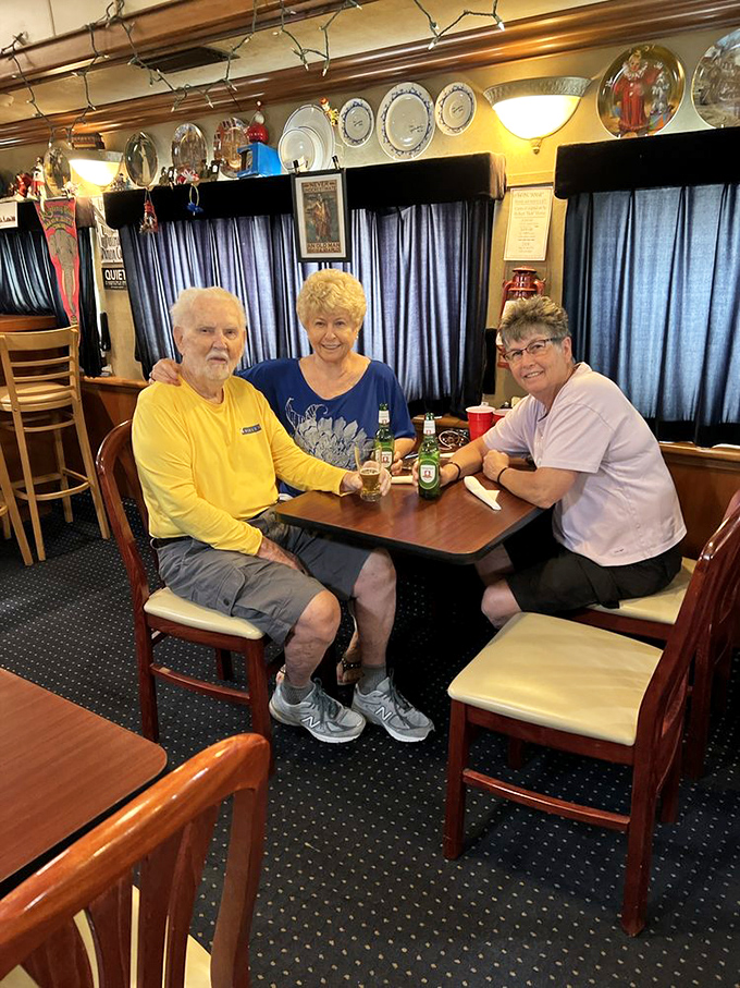 Happy diners gather around tables that once served passengers traveling across America, now enjoying stationary feasts with historical flavor.
