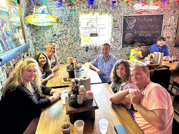 Diners: Happy patrons creating memories under a ceiling of other people's memories &ndash; the circle of dining life at No Name Pub.