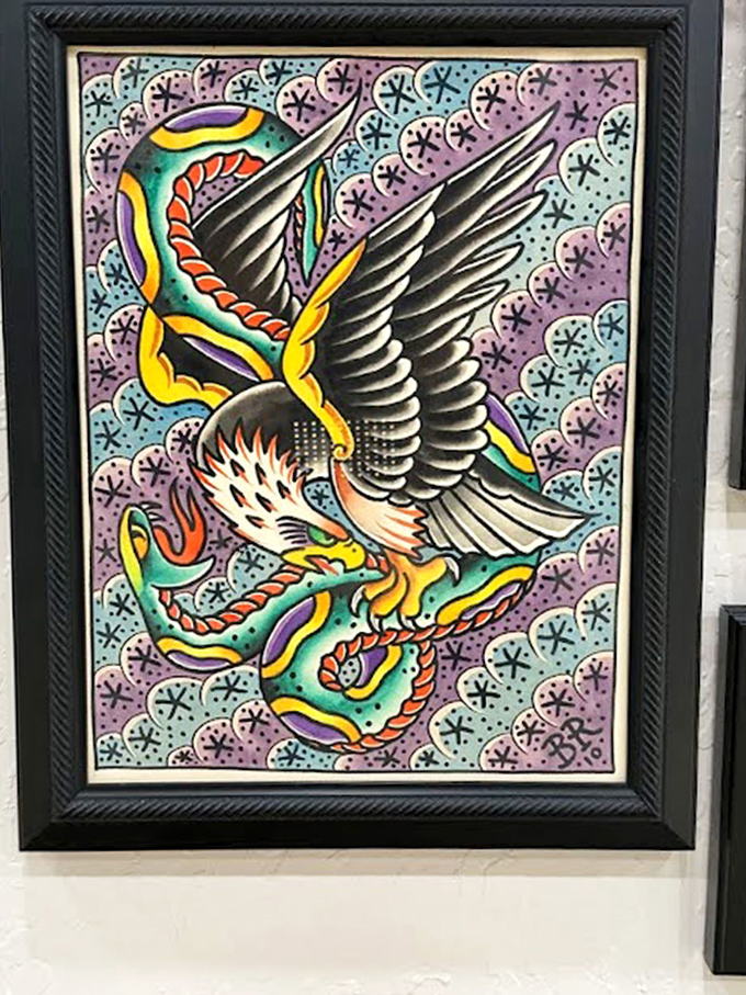 Bold colors and strong symbolism &ndash; this eagle and snake design exemplifies traditional American tattoo aesthetics.