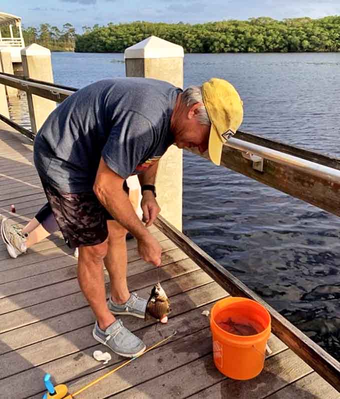 The age-old dance between angler and fish plays out on the dock, where patience is rewarded with the satisfying tug of dinner on the line.