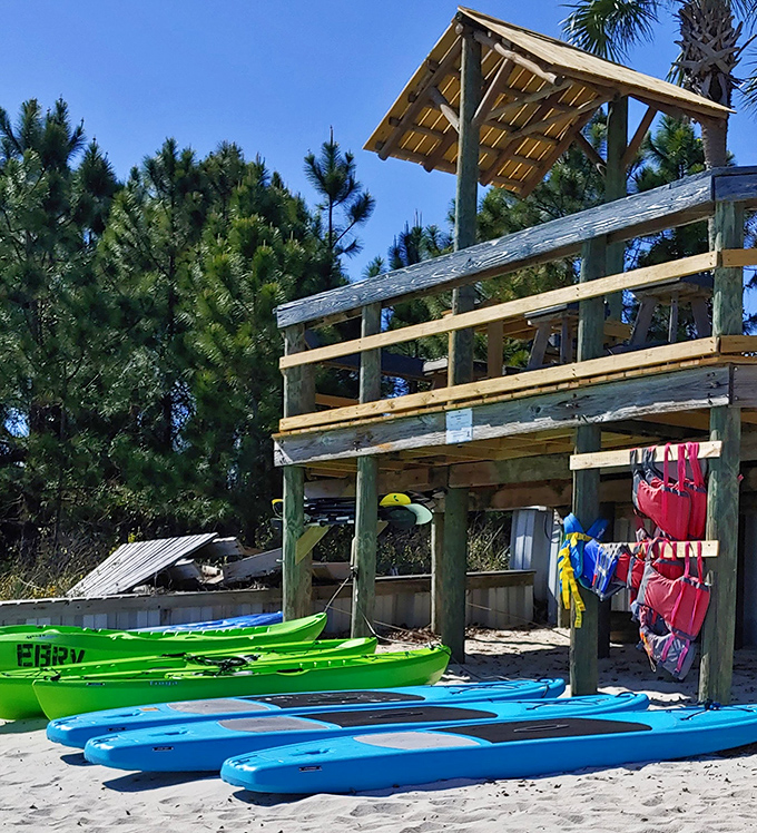 Colorful kayaks stand ready for adventure &ndash; your chariot awaits for exploring hidden coves and working off last night's seafood feast.