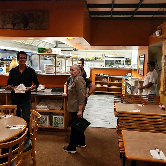 A glimpse into the kitchen where the magic happens &ndash; organized chaos producing plates of perfection throughout the evening.