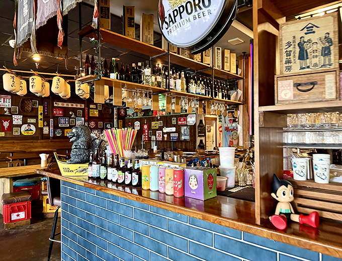 The open counter hums with energy as dishes are prepared fresh behind bright decorations.