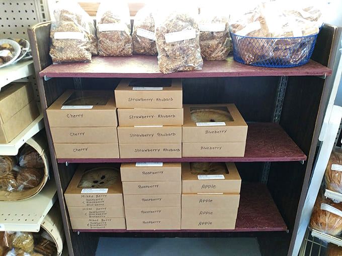 Boxed pies ready for transport, each one a portable party that's about to make someone's day significantly better than it was five minutes ago.