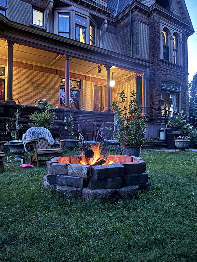 Evening Enchantment: As twilight falls, the castle's fire pit glows with promise&mdash;the perfect spot for stargazing and storytelling.