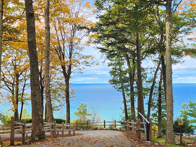 This breathtaking overlook reveals why they call it "Great" Lakes &ndash; Lake Michigan stretches to the horizon, framed perfectly by autumn-touched trees. 