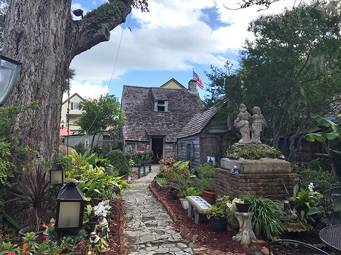 Stone pathways wind through lush gardens, leading visitors on a journey through time to America's oldest wooden temple of learning.