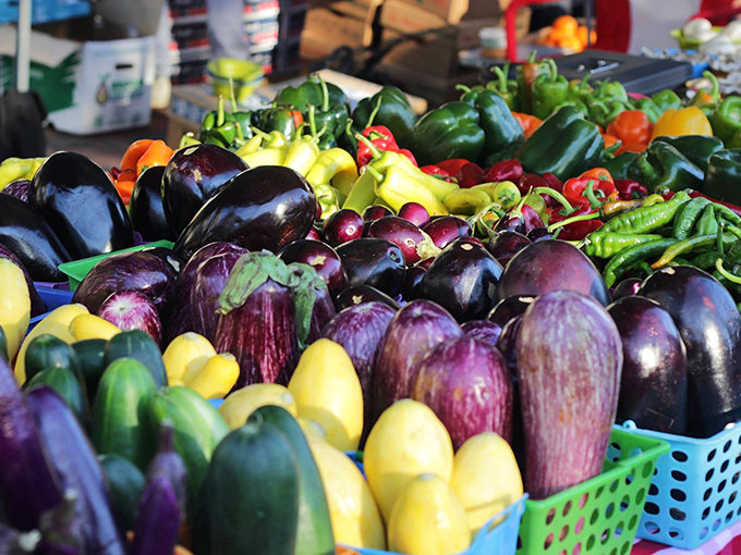 A rainbow of eggplants and peppers creates a visual feast that's almost too pretty to eat – almost, but not quite.