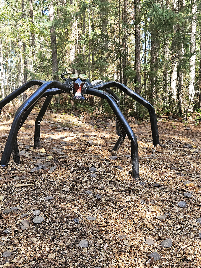 This imposing arachnid sculpture creates an archway over the path, turning what might be frightening in nature into a playful photo opportunity.