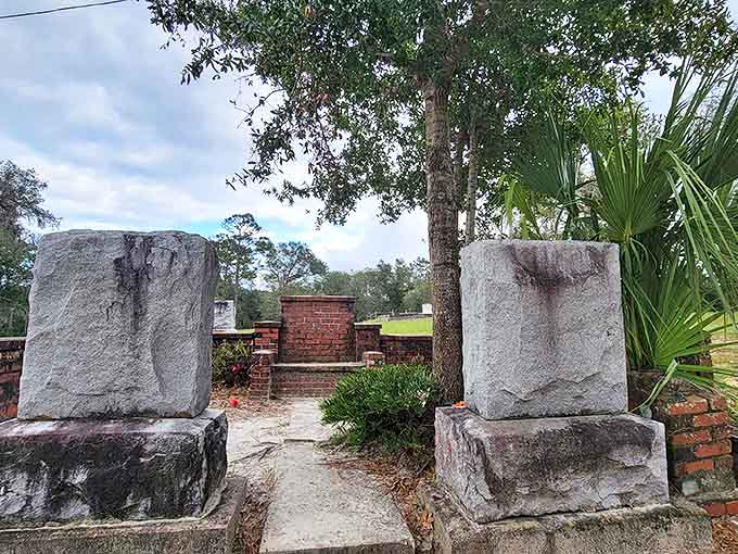 The graves surrounding the chair remind visitors that this is a real cemetery with real people resting here, not just a supernatural theme park for thrill-seekers.