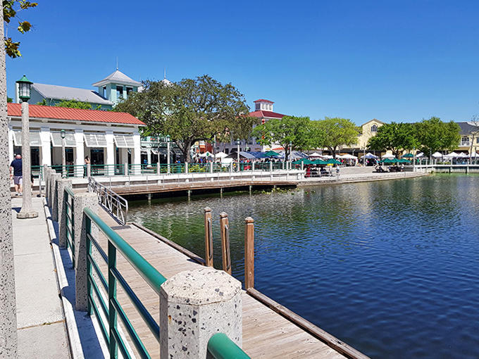 The boardwalk offers front-row seats to Celebration's waterfront charm, where every bench tells a different story.