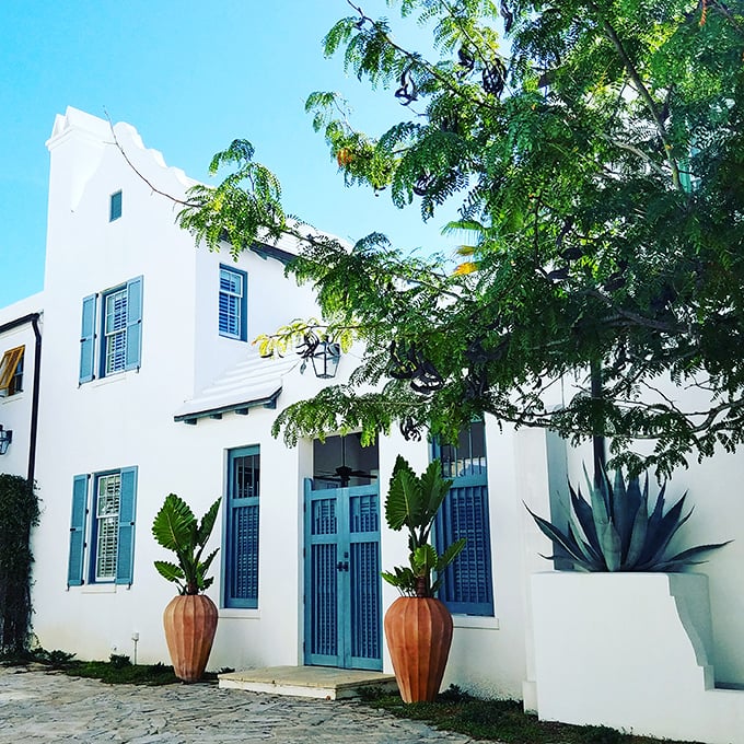 Blue shutters against white walls: the classic coastal color combo that never goes out of style.
