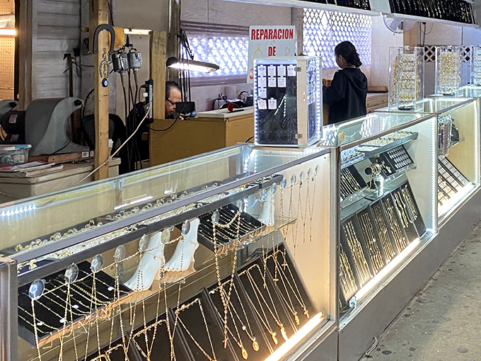 Jewelry repair in progress &ndash; where family heirlooms and impulse purchases receive equal care behind gleaming glass counters.