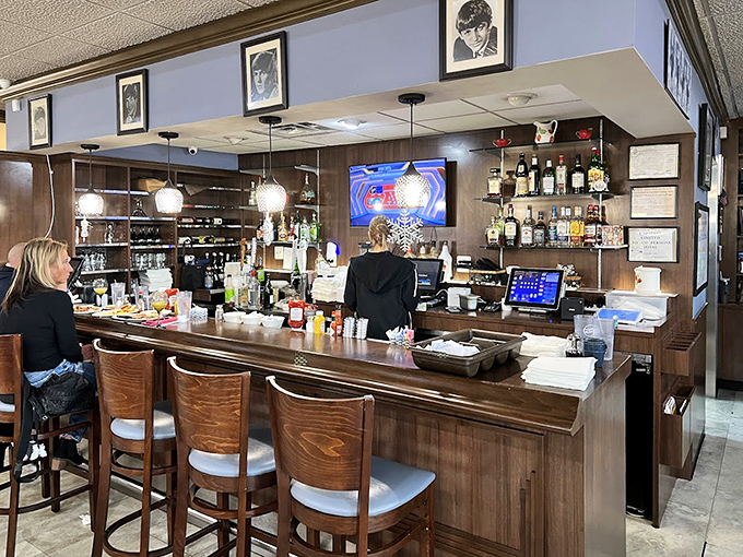 The bar area offers a cozy spot to enjoy a drink, where strangers become friends over shared Beatles trivia and menu recommendations.
