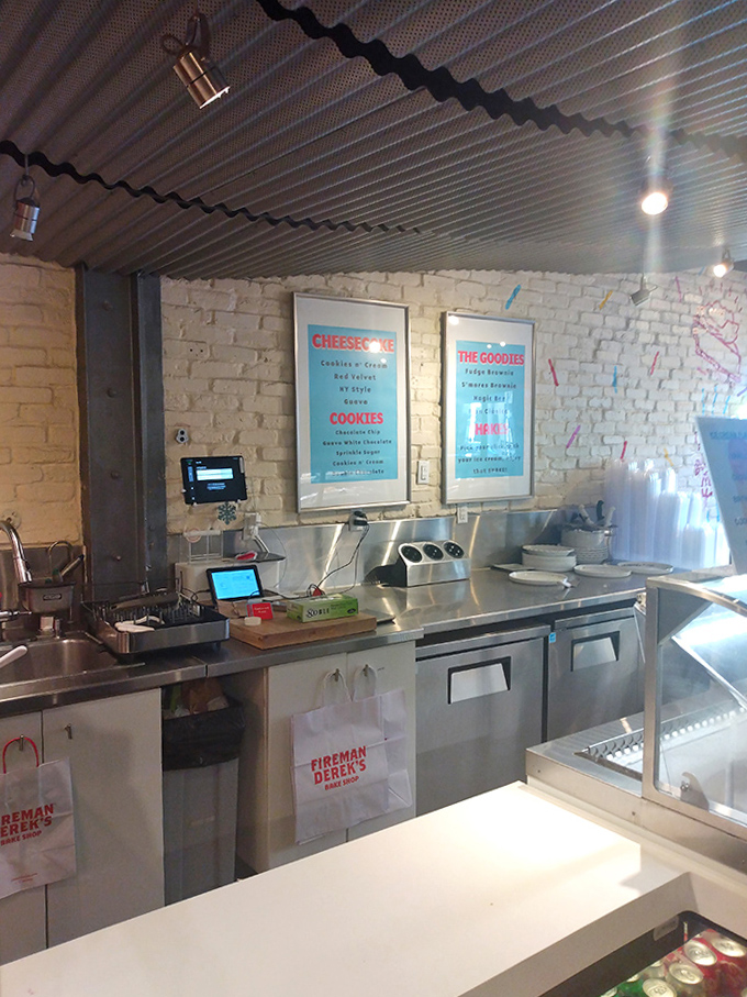 Where dessert dreams come true &ndash; the ordering counter at Fireman Derek's, backed by exposed brick and colorful menu boards.