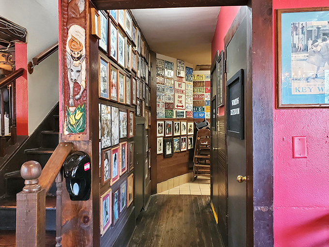 The hallway gallery feels like walking through Florida's eccentric history, where every frame holds a memory and every corner reveals another quirky treasure.