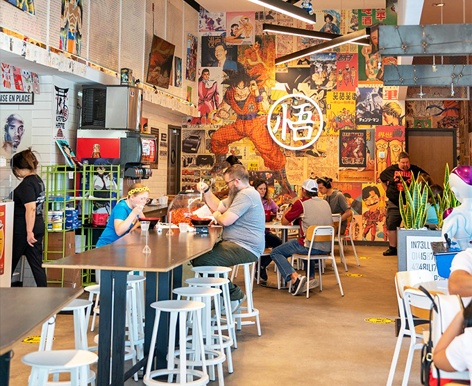 The dining area buzzes with the energy of fans united by two universal languages: great food and animated storytelling.