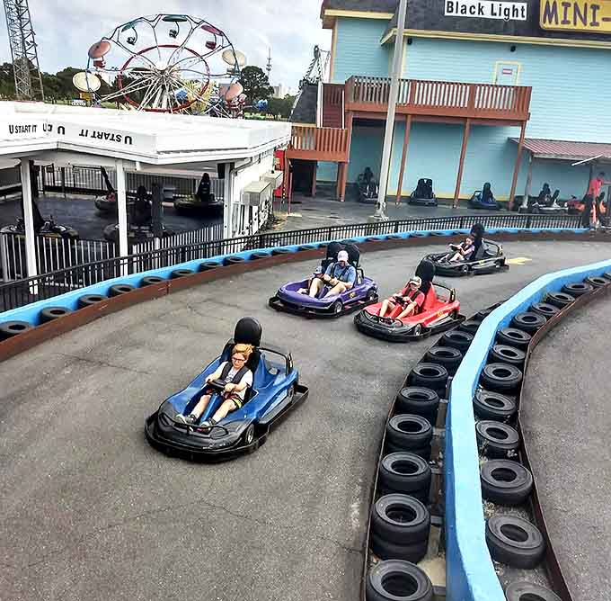 Drivers navigate the winding track with expressions ranging from "Sunday driver" to "escaped convict," regardless of actual speed.