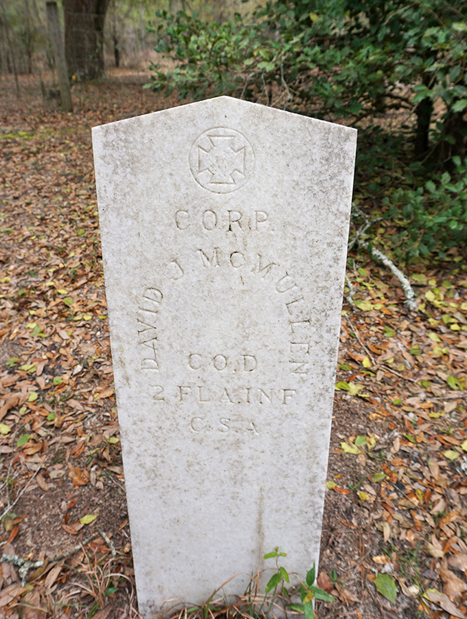 This military headstone honors Corporal David J. McMullen of the Confederate Army, connecting local history to national narratives.