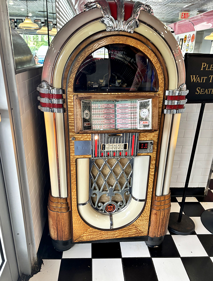 The vintage jukebox stands ready to provide the soundtrack to your meal, its wooden cabinet and chrome details a museum piece that still plays Elvis.