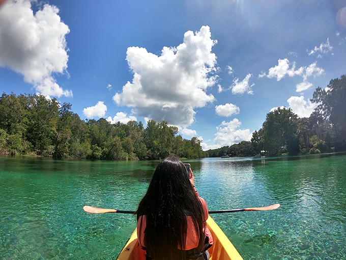 Kayaking: A peaceful paddler glides through waters so transparent it looks like they're floating on air rather than navigating Florida's most beautiful river.