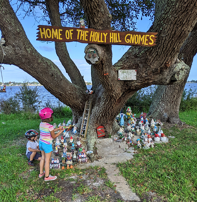 Young explorers discover the magic of the Holly Hill Gnome Tree, where every visit becomes a scavenger hunt for ceramic characters hiding in plain sight.