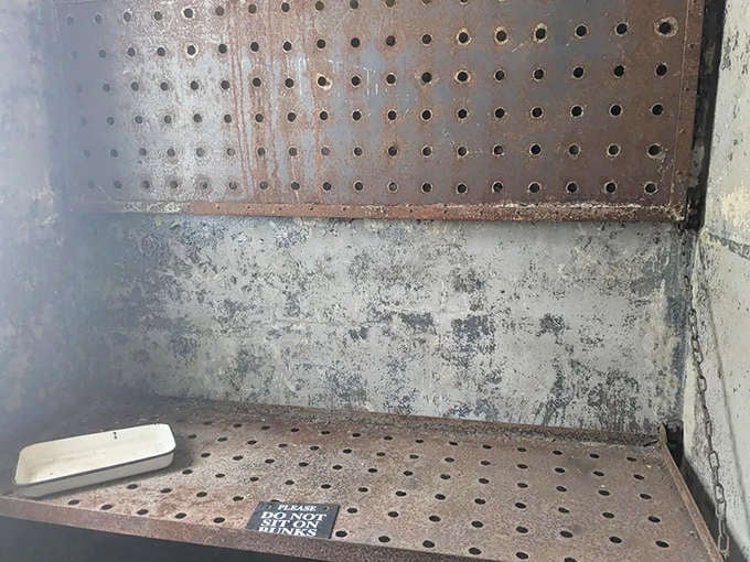 These metal bunks folded down to provide sleeping surfaces that made camping on rocks seem like a luxury spa experience.