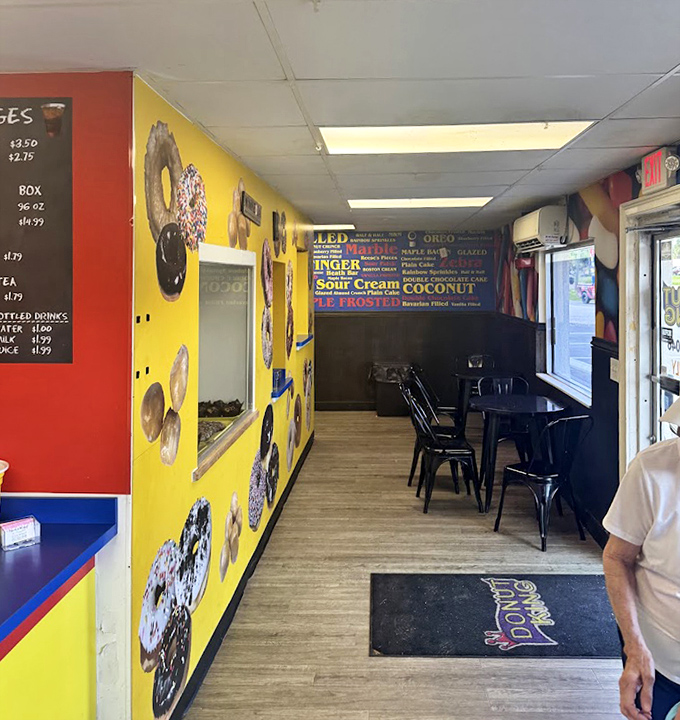 The shop's narrow but cheerful interior leads customers past walls of donut-themed decor to sweet, fried treasure.