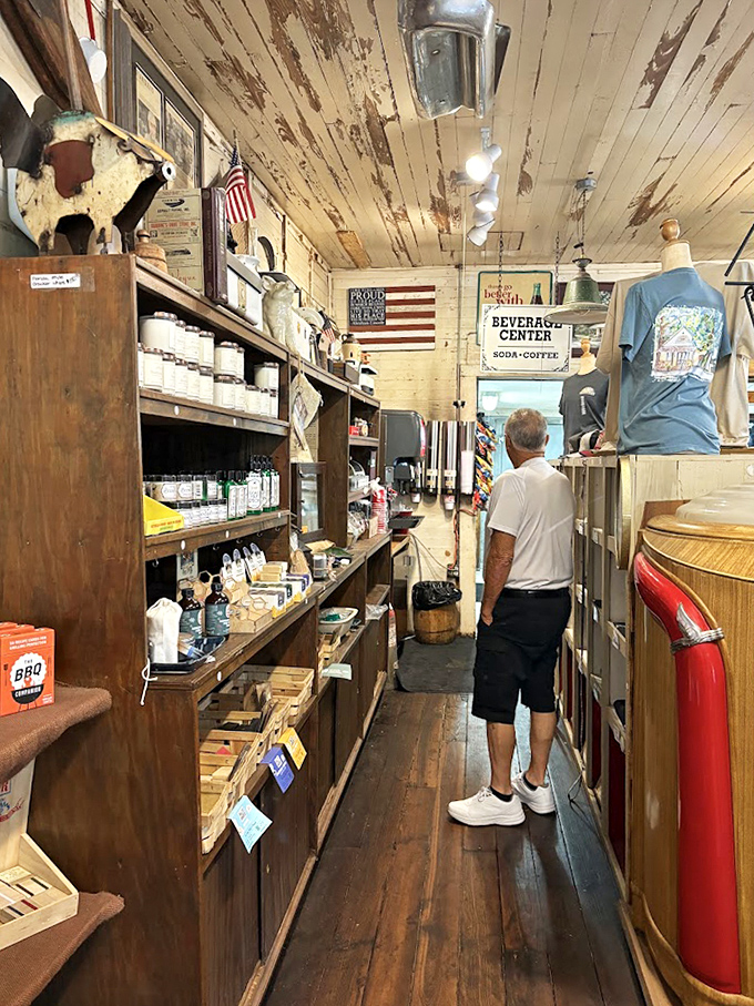 Narrow aisles packed with treasures create a treasure hunt atmosphere where every shelf holds potential discoveries and forgotten flavors.