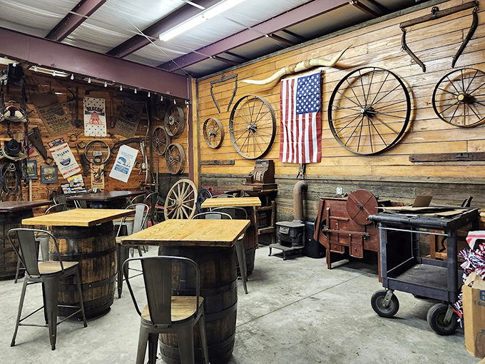 Rustic charm meets practical function &ndash; barrel tables, wagon wheel d&eacute;cor, and an American flag create a dining space that feels authentically patriotic.