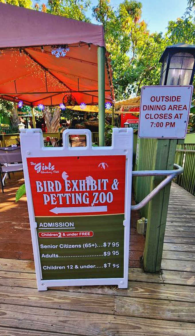 Clear signage displays admission rates for the bird exhibit and petting zoo, where families can experience close encounters with friendly creatures of all kinds.