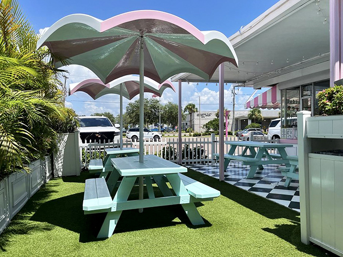 Mint green picnic tables under whimsical umbrellas create the perfect stage for ice cream enjoyment—where calories don't count and memories definitely do.