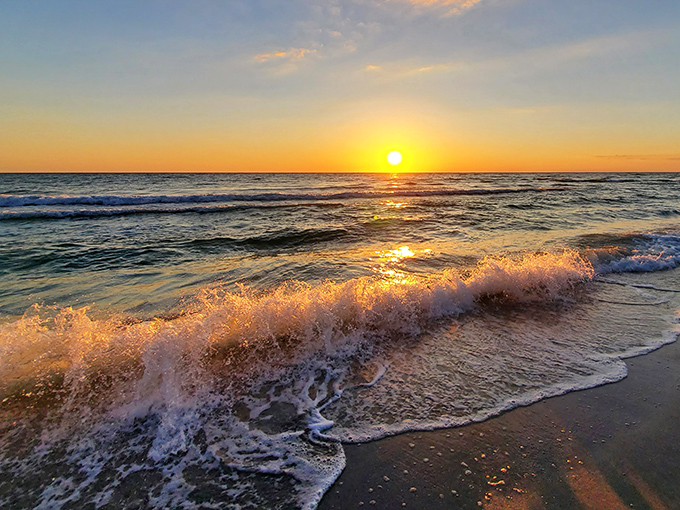 Sunset paints the Gulf waters in liquid gold, as gentle waves provide nature's soundtrack to another perfect ending on Boca Grande's shores.