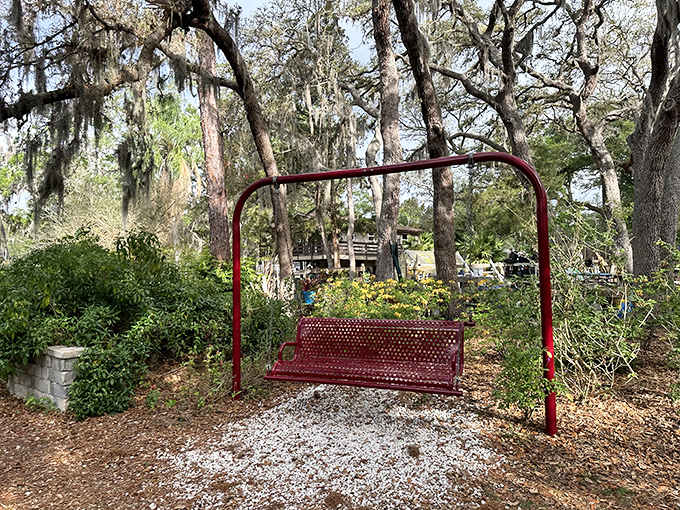 This red swing beckons visitors to pause and sway, a simple pleasure that somehow feels revolutionary in our busy world.
