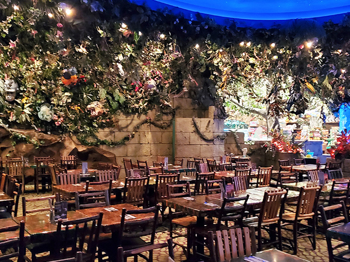 Even during quieter hours, the restaurant maintains its magical atmosphere with twinkling lights and lush greenery surrounding comfortable wooden tables.