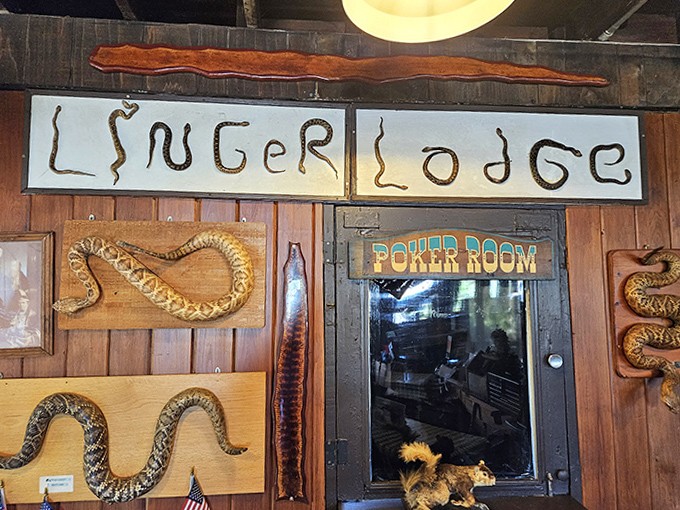Wall Decor: The restaurant's name slithers across the wall in preserved snake form &ndash; just one example of the creative taxidermy that makes this place unforgettable.