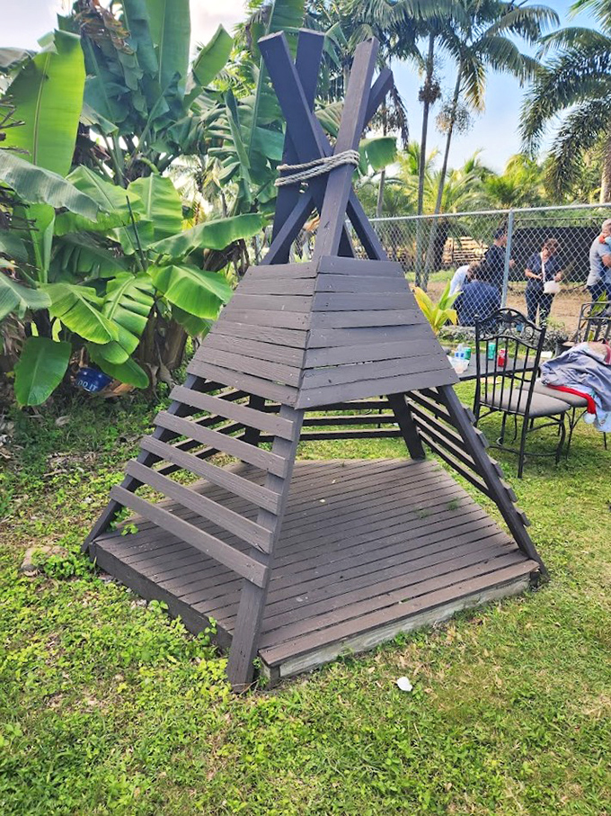 This wooden A-frame structure seems designed specifically for contemplative moments or impromptu philosophy discussions.