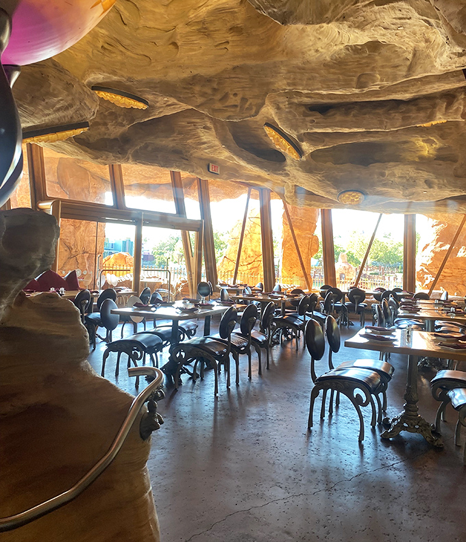 Dramatic lighting transforms stone walls into warm, inviting dining spaces where every table feels like a private grotto.