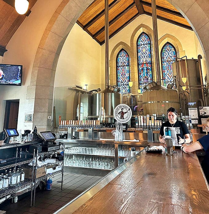 Knowledgeable staff guide patrons through beer offerings without pretension, moving through the space with the confidence of people who genuinely enjoy their work.