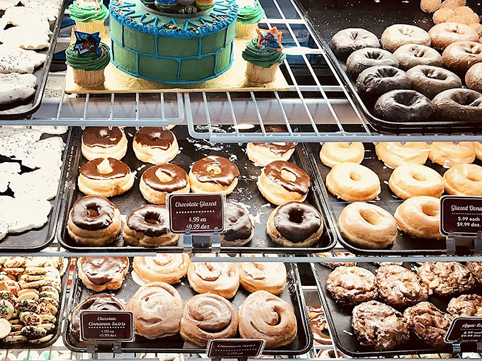Baked Goods Display Case: The glass barrier between impulse and indulgence &ndash; where pointing fingers leave evidence of desire on perfectly clean surfaces.