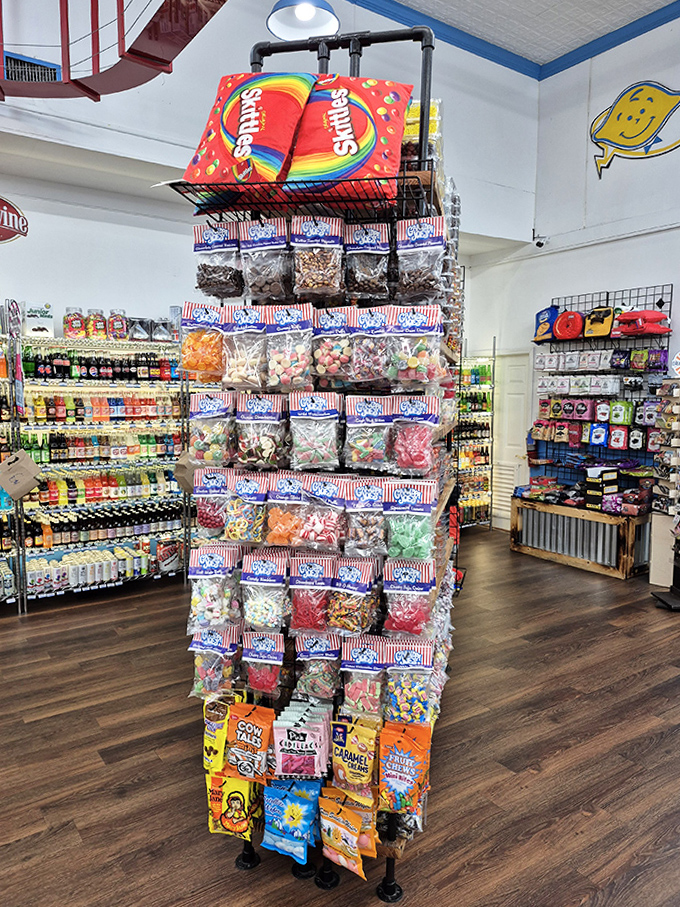 A tower of temptation with striped bags standing at attention, ready to march straight into your shopping basket.