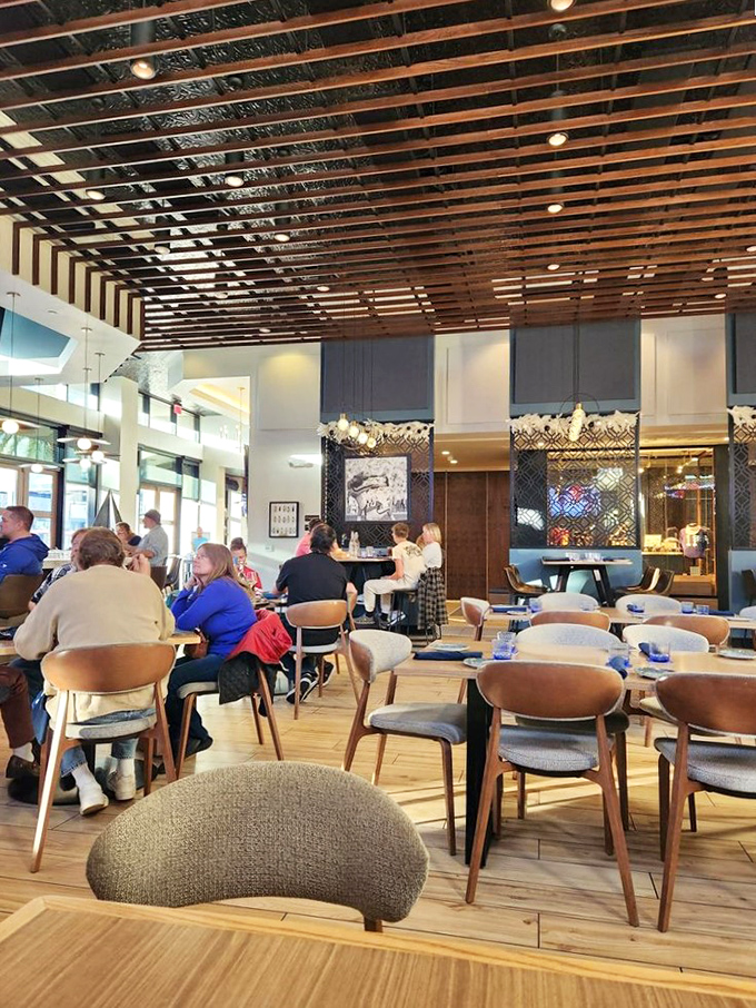 The restaurant's thoughtful design creates spaces where conversations flow as easily as the drinks, with warm wood accents and comfortable seating encouraging guests to linger.