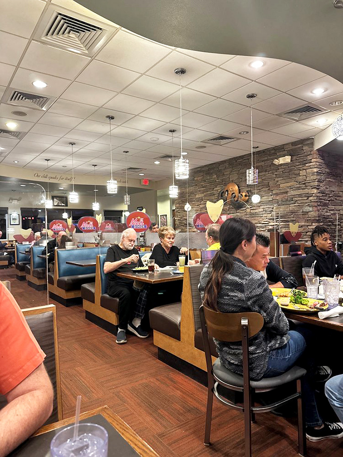 Diners settle into comfortable booths, creating that perfect hum of conversation and silverware that forms the soundtrack of a beloved local eatery.