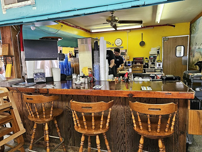 Counter seating offers front-row tickets to the breakfast show, where skilled cooks transform simple ingredients into morning magic.