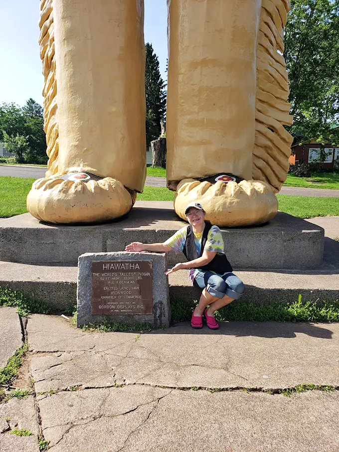 The massive scale becomes apparent when visitors pose with Hiawatha's moccasins, which are larger than most garden sheds and meticulously detailed.