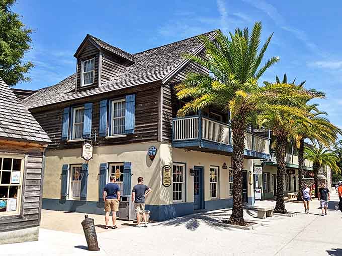 Historic wooden storefronts on St. George Street house sweet temptations and souvenir shops where wallets mysteriously become lighter.